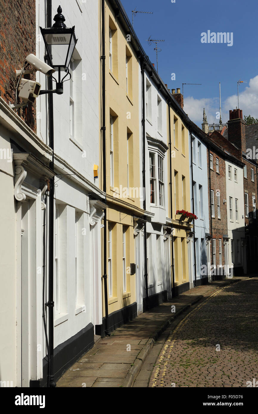 A crescent of pastel coloured Georgian houses in Hull, England. The ...