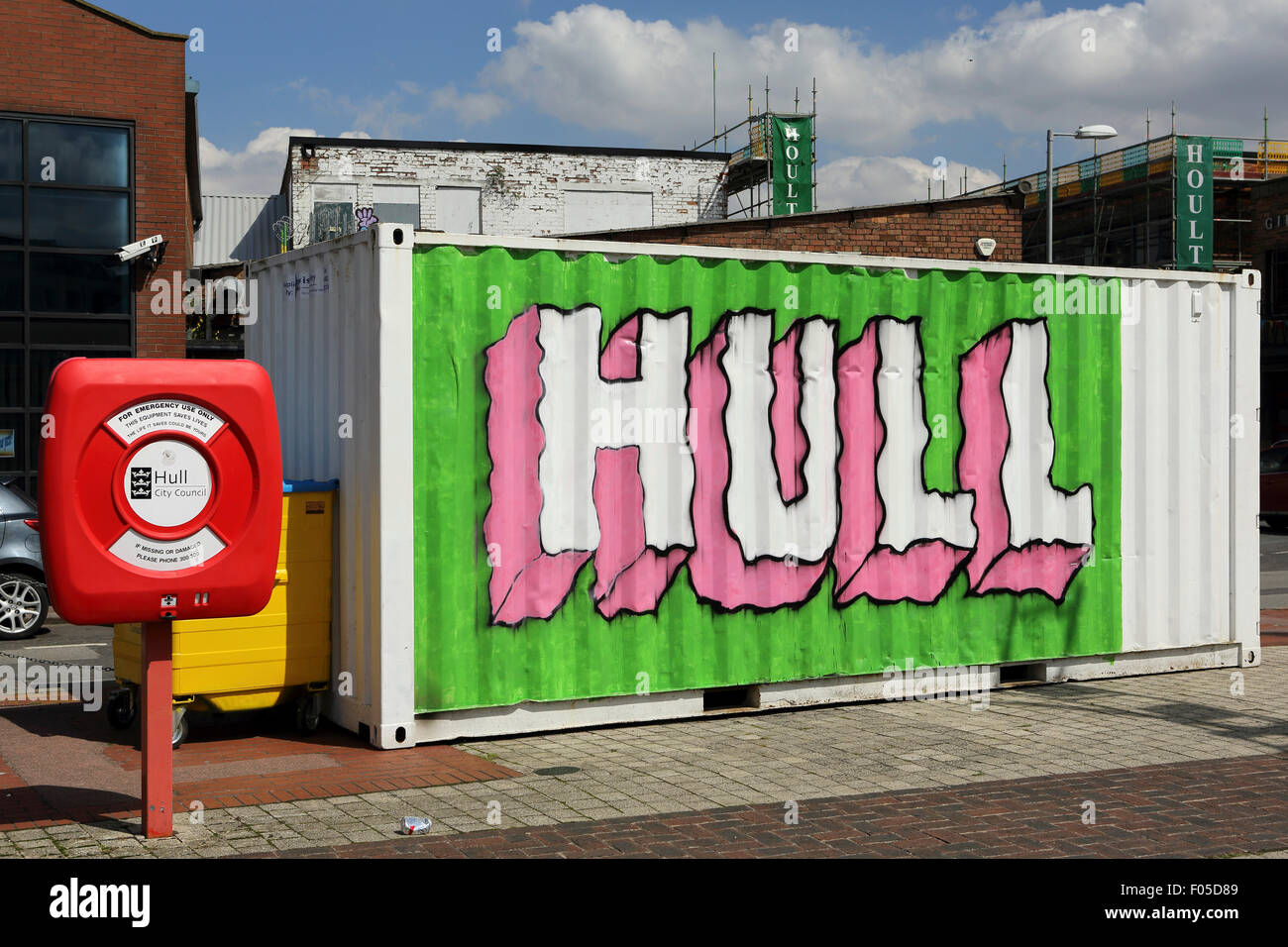A green and white container bears the word Hull by the marina in Hull ...