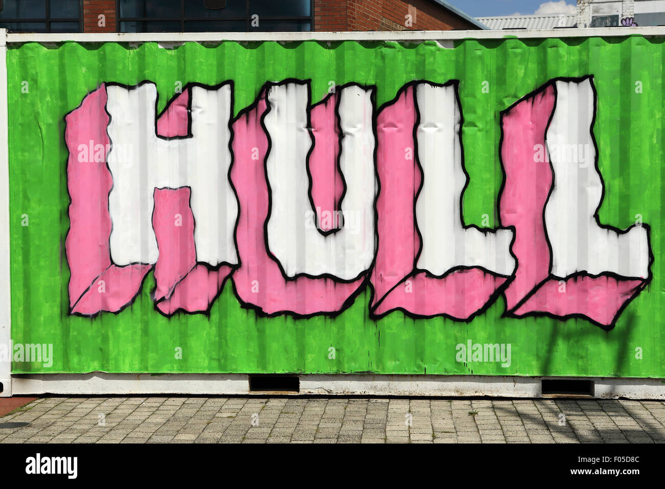 A green and white container bears the word Hull by the marina in Hull ...