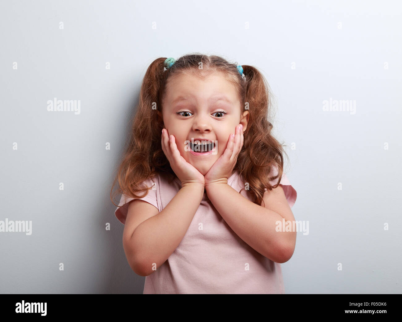 Happy very excited kid girl with open mouth looking. Closeup portrait ... Happy very excited kid girl with open mouth looking. Closeup portrait ...