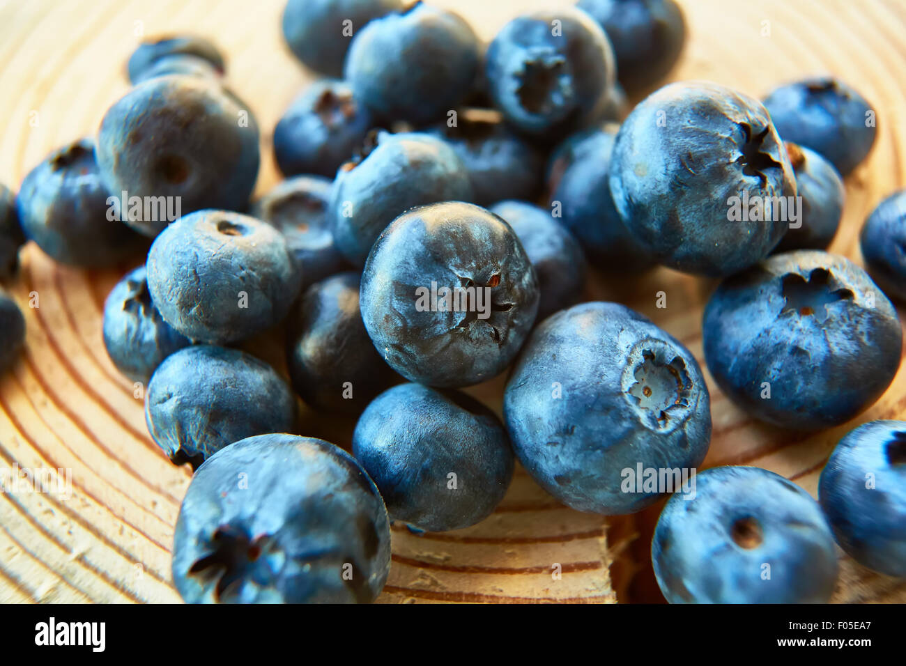 Freshly picked blueberries on wooden background. Shallow dof Stock ...