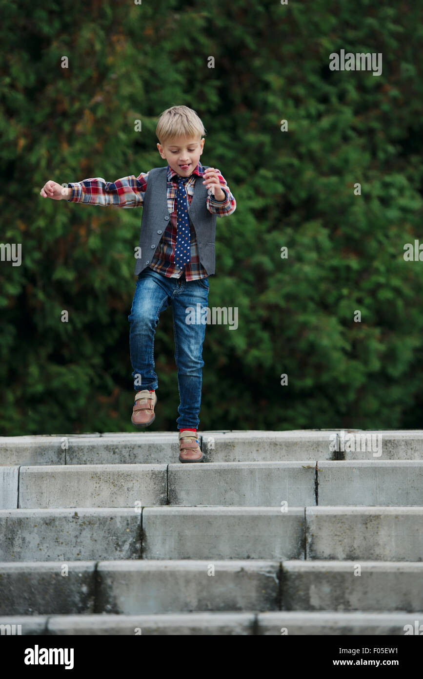 little boy jumping on the stairs Stock Photo - Alamy