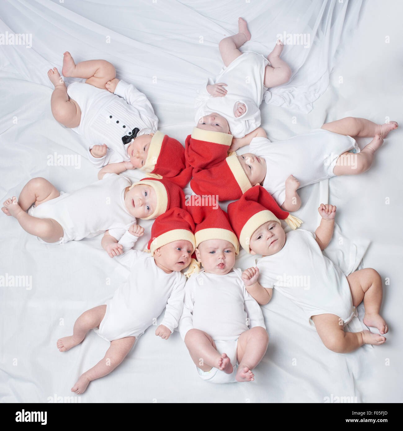 babies with santa hats on bright background Stock Photo - Alamy