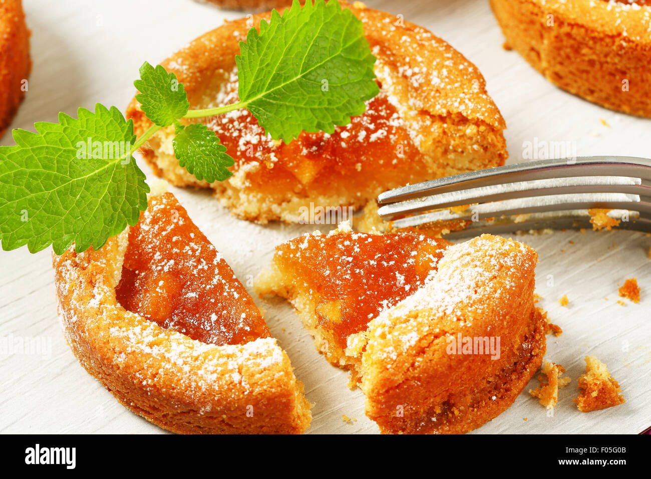 Small round cakes filled with apple puree Stock Photo - Alamy