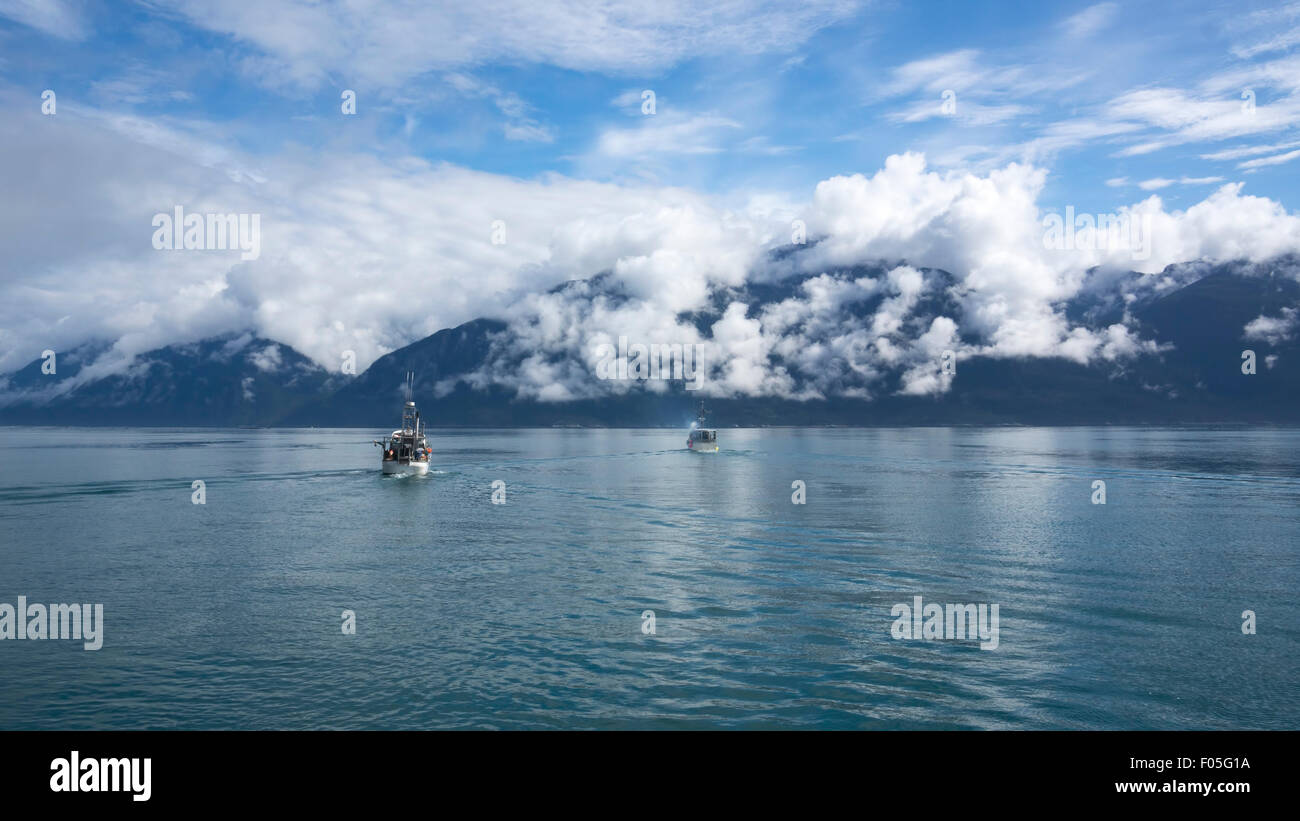 Commercial salmon fishing boats heading out to fish in the Lynn Canal ...