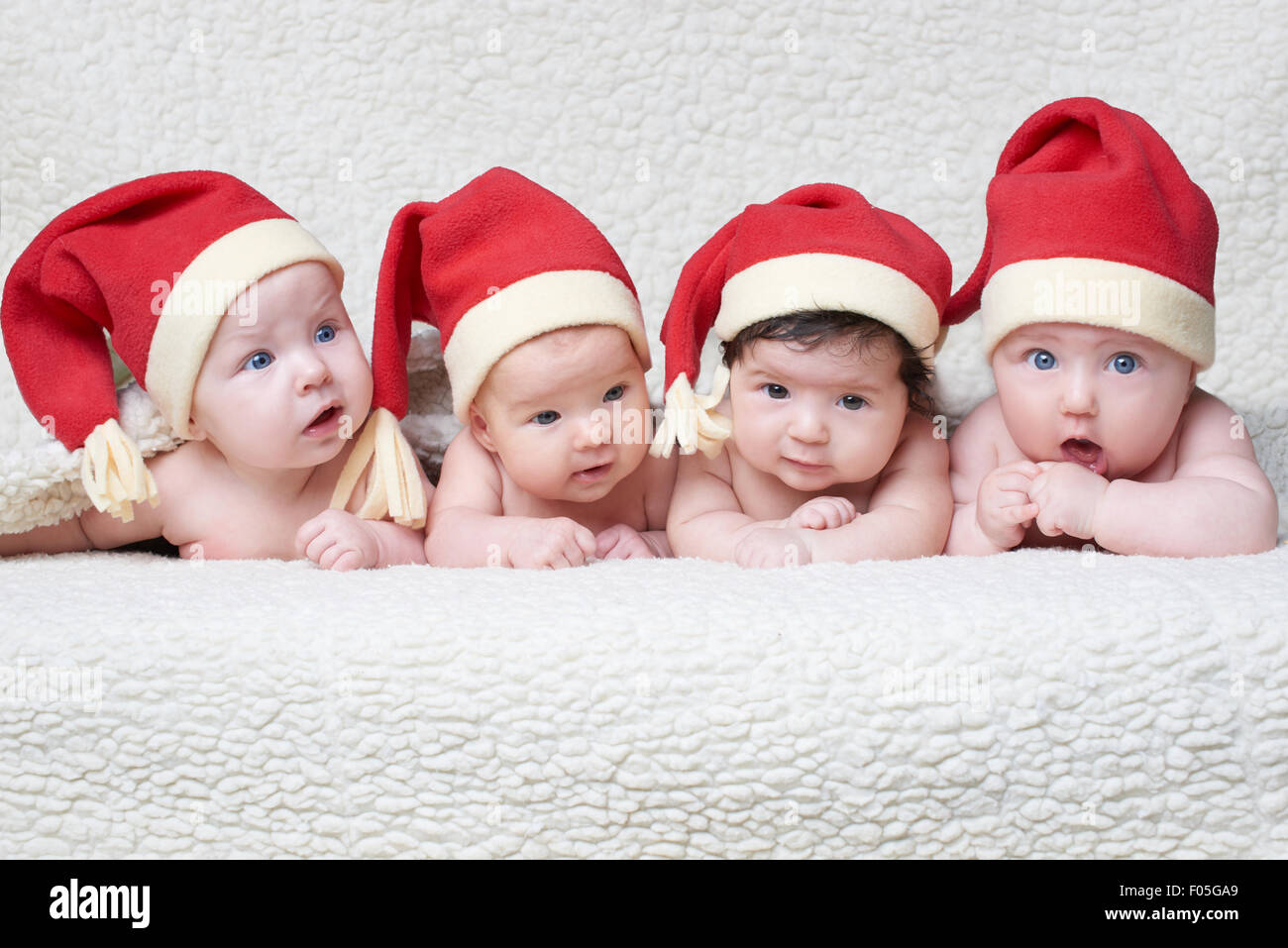 babies with santa hats on bright background Stock Photo - Alamy