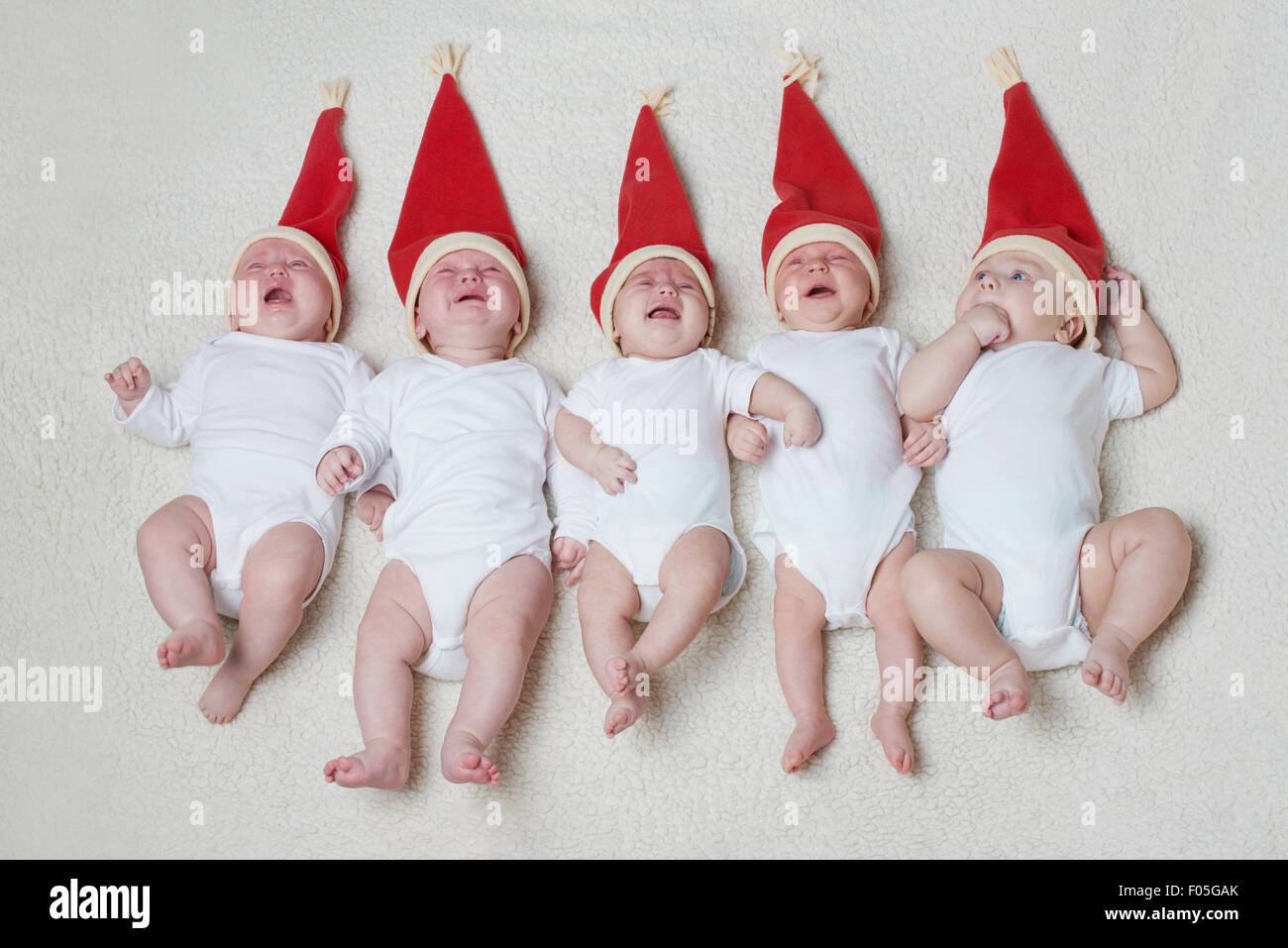 Santa claus holding babies hi-res stock photography and images - Alamy