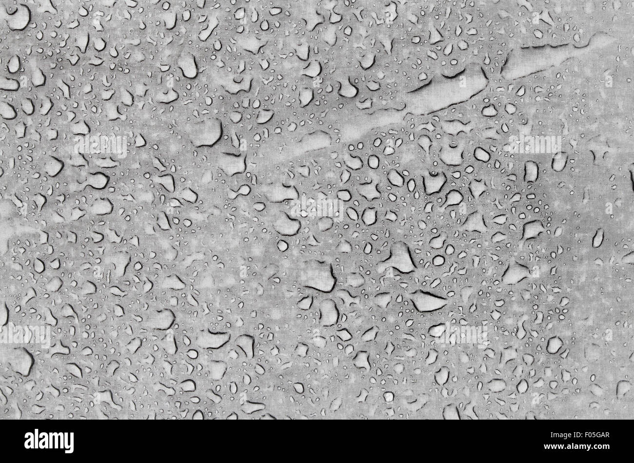 Water drops on fabric as a background and texture Stock Photo - Alamy