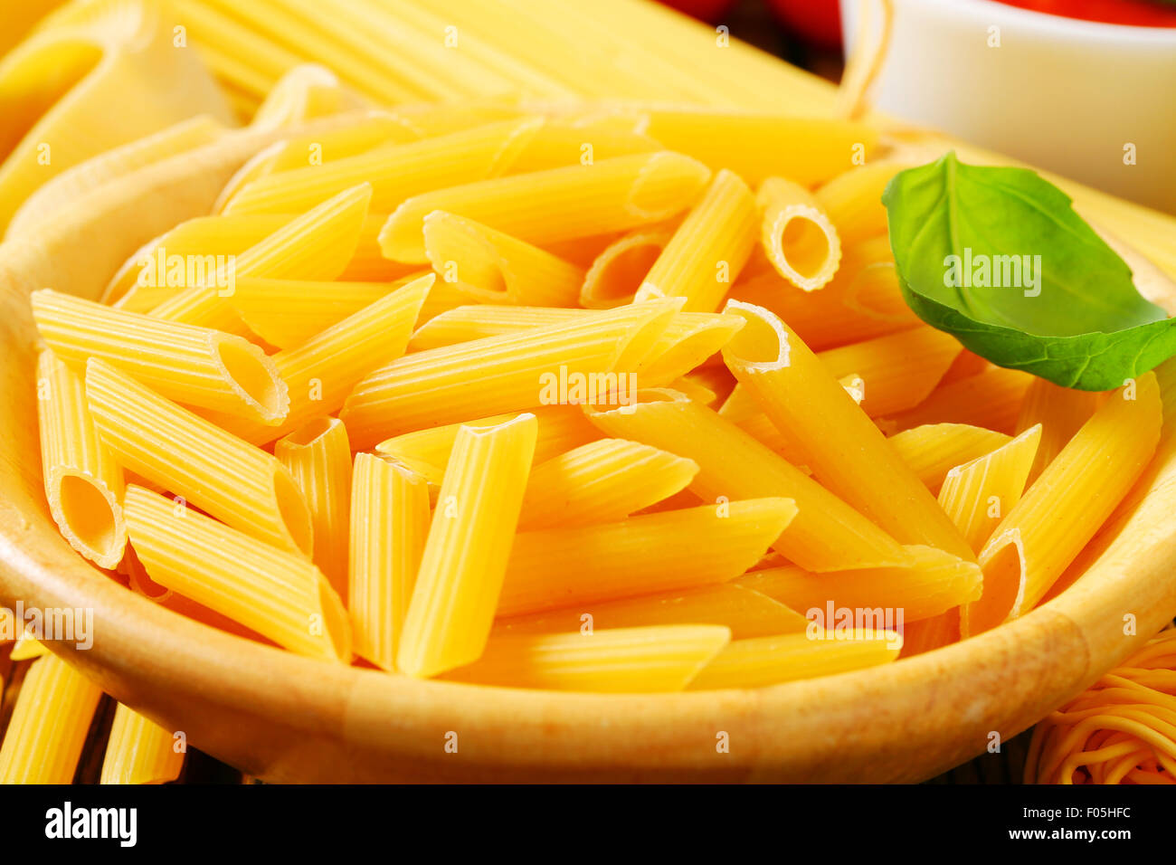 Bowl of uncooked pasta tubes Stock Photo - Alamy