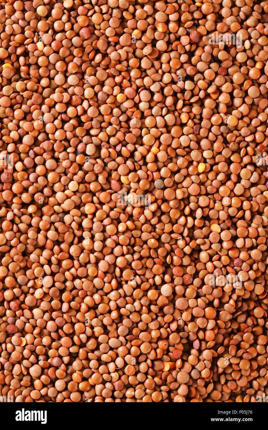 Raw whole red lentils - background Stock Photo - Alamy