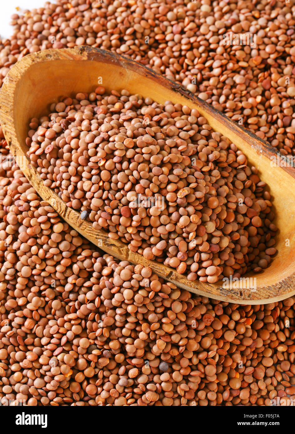 Whole red lentils in natural edge bowl Stock Photo - Alamy