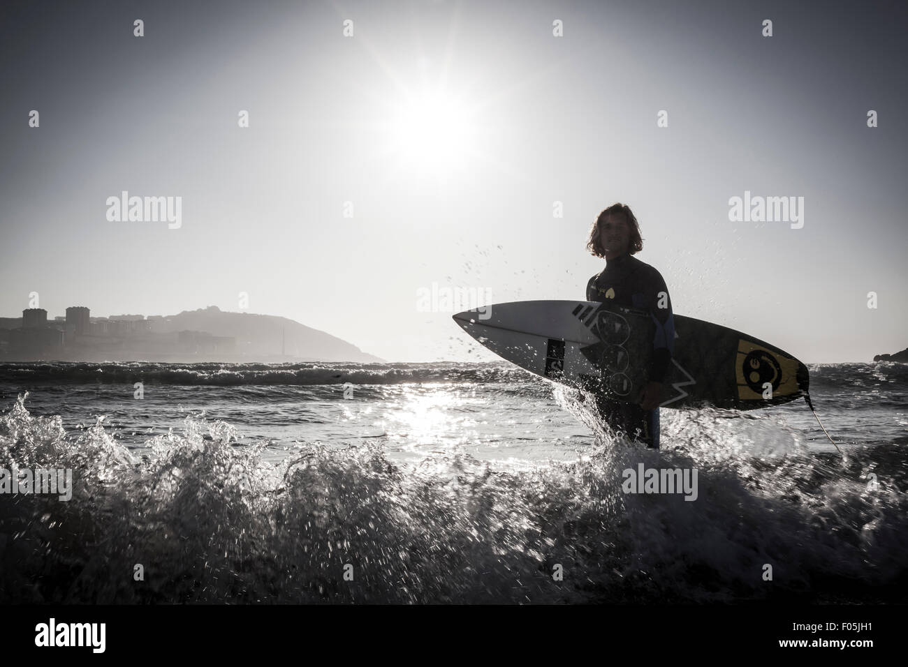 Surfer Pablo Macineira holding surfboard. Orzan Beach. A Coruna ...