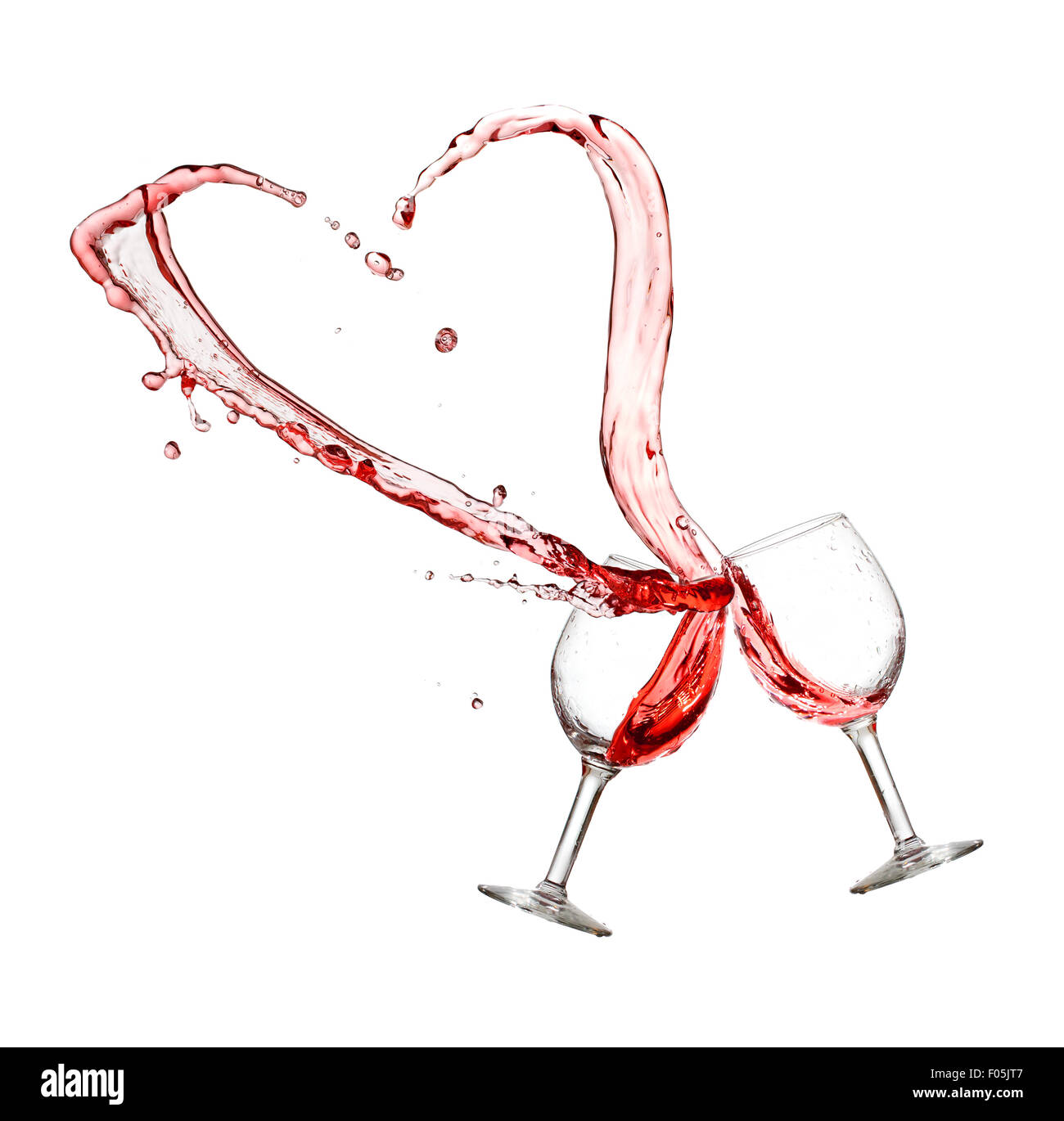 Heart splash from two glasses of red wine isolated on white background ...