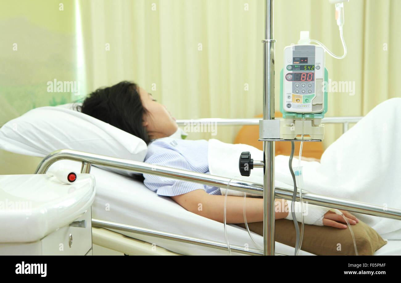 Woman patient in hospital bed with medical infusion drip tool Stock ...
