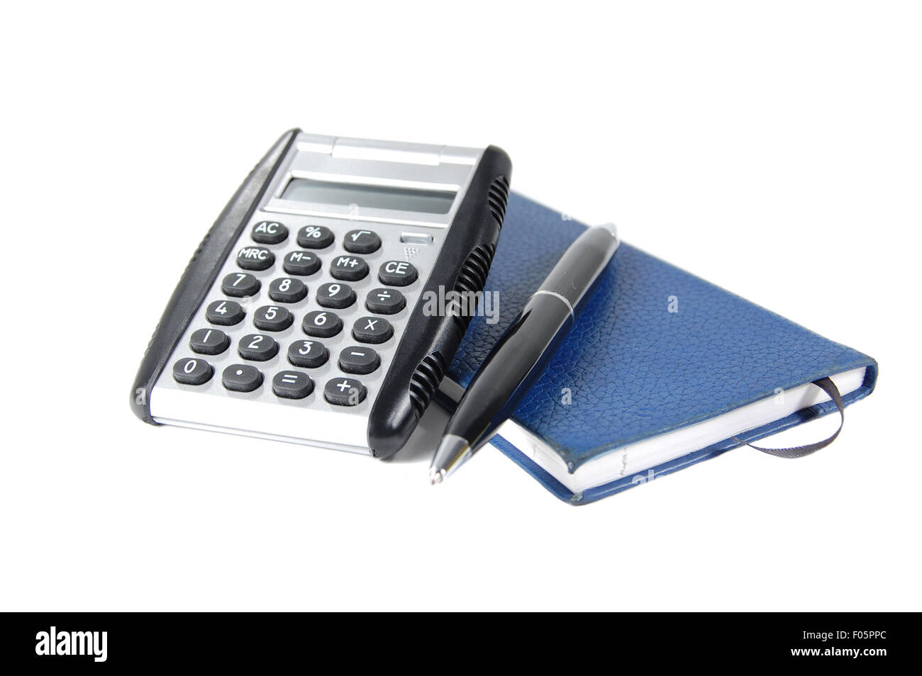 Close up of a pen and a calculator on a check book isolated on white ...