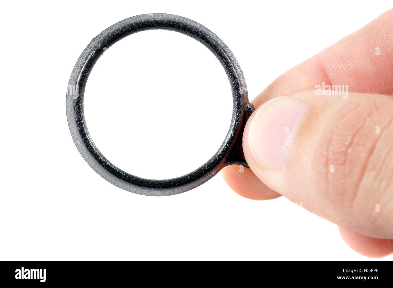 Macro of fingers holding a small magnifying glass Stock Photo - Alamy