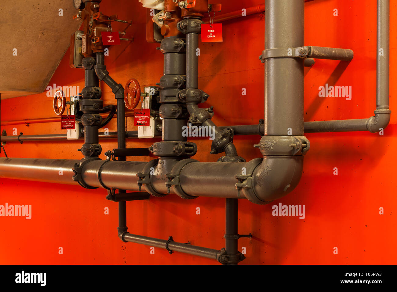 Plumbing system controls mounted on a stairwell wall in a LEED ...