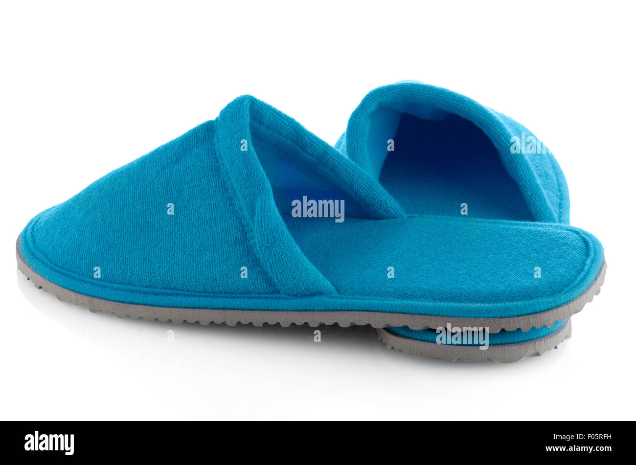 A pair of blue slippers on a white background Stock Photo - Alamy