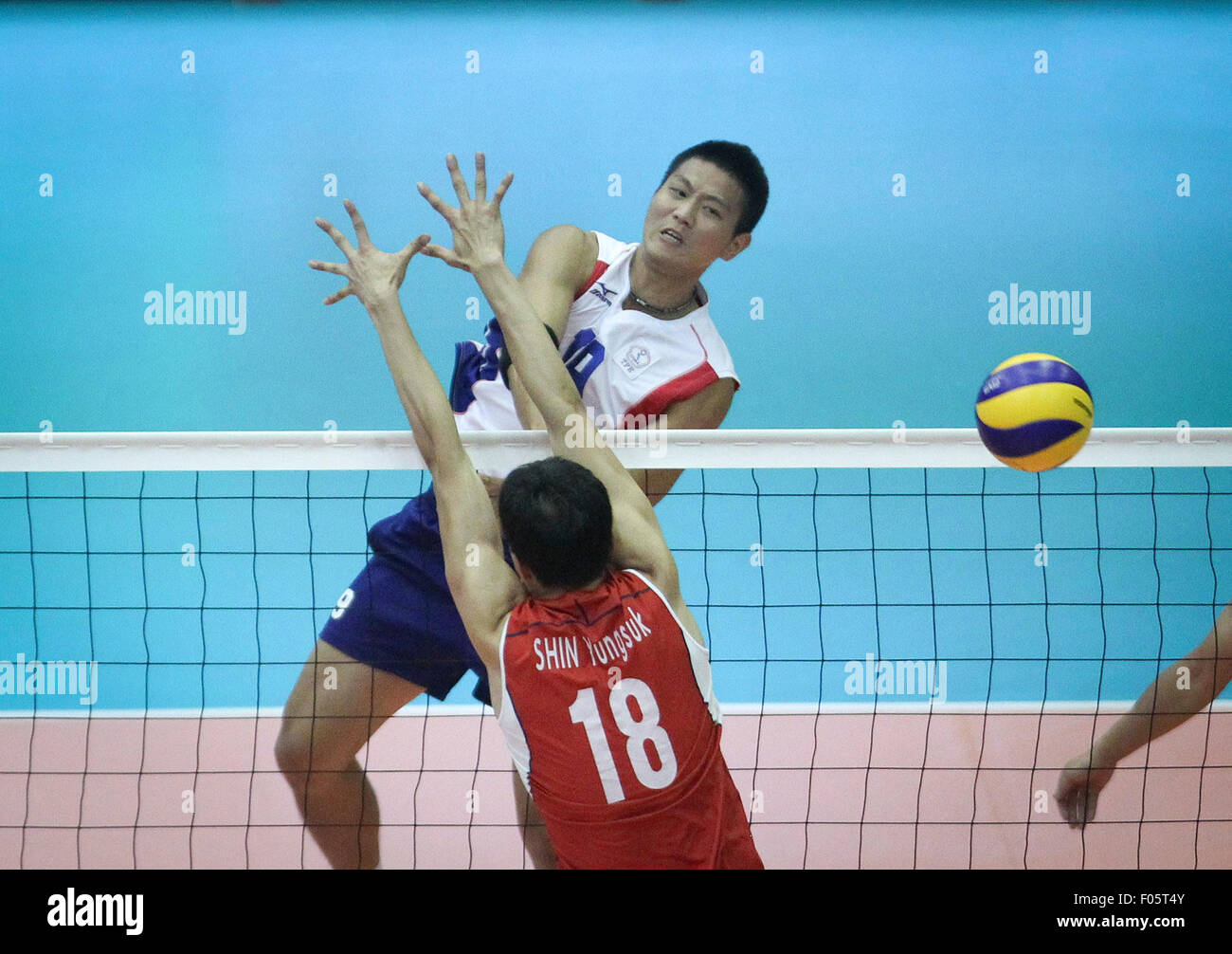 Tehran, Iran. 7th Aug, 2015. Chien-Chen Chen (top) of Chinese Taipei spikes the ball during the ...
