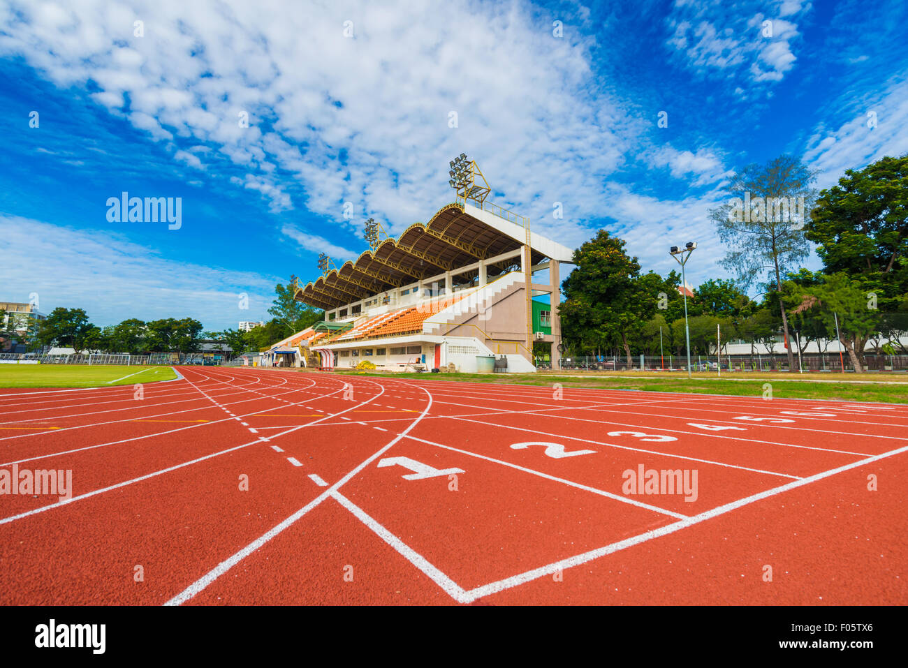 Running track in stadium against blusky, Colourful sport Stock Photo ...
