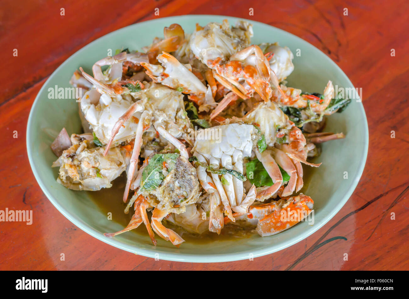 Stir fried Crab with chili & Basil leaves , spicy seafood dish Stock ...