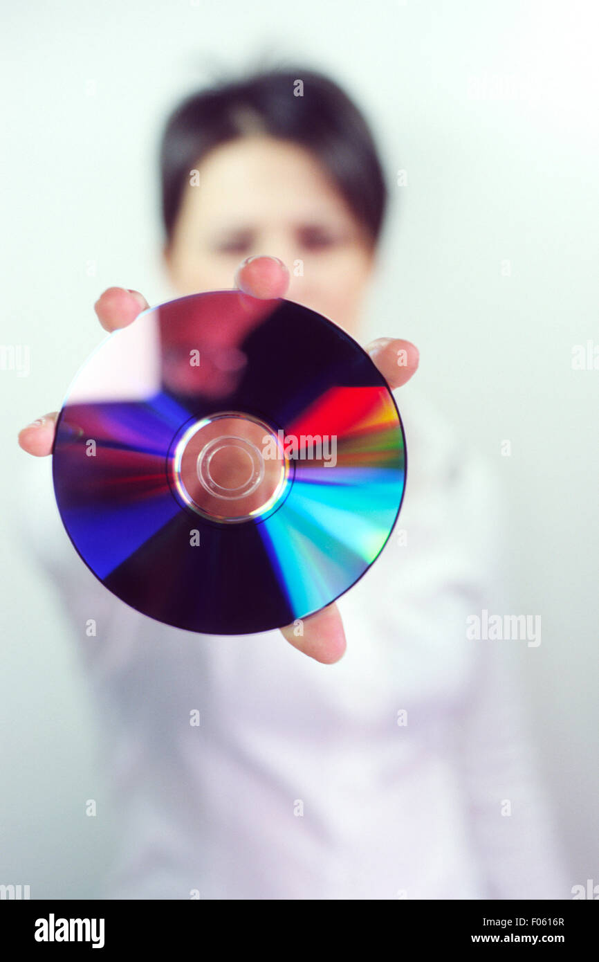 Close-up of a woman holding a CD Stock Photo - Alamy