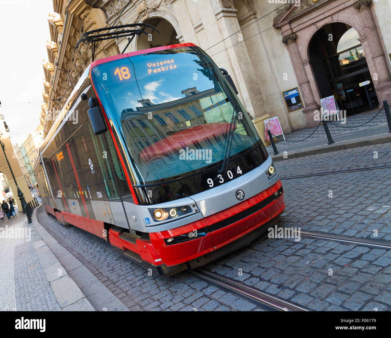 Red tram in the old town side. The Prague tramway (streetcar) network ...