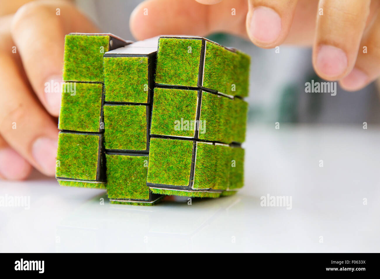 Green rubik's cube concept Stock Photo - Alamy