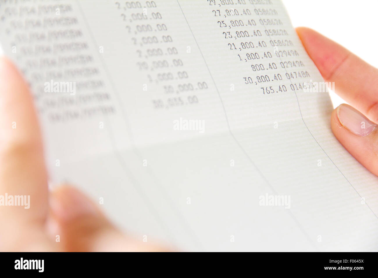 hand holding bank account book Stock Photo - Alamy