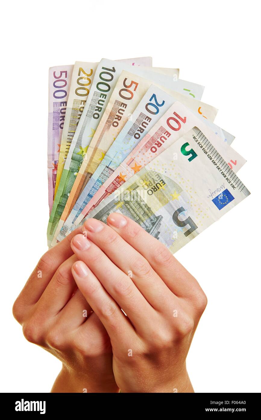 Two hands holding fan of Euro money bills Stock Photo - Alamy
