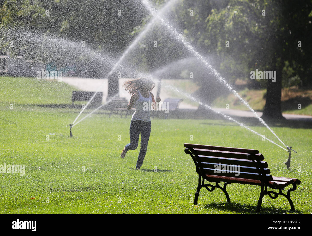 Girl running water fountain hi-res stock photography and images - Alamy