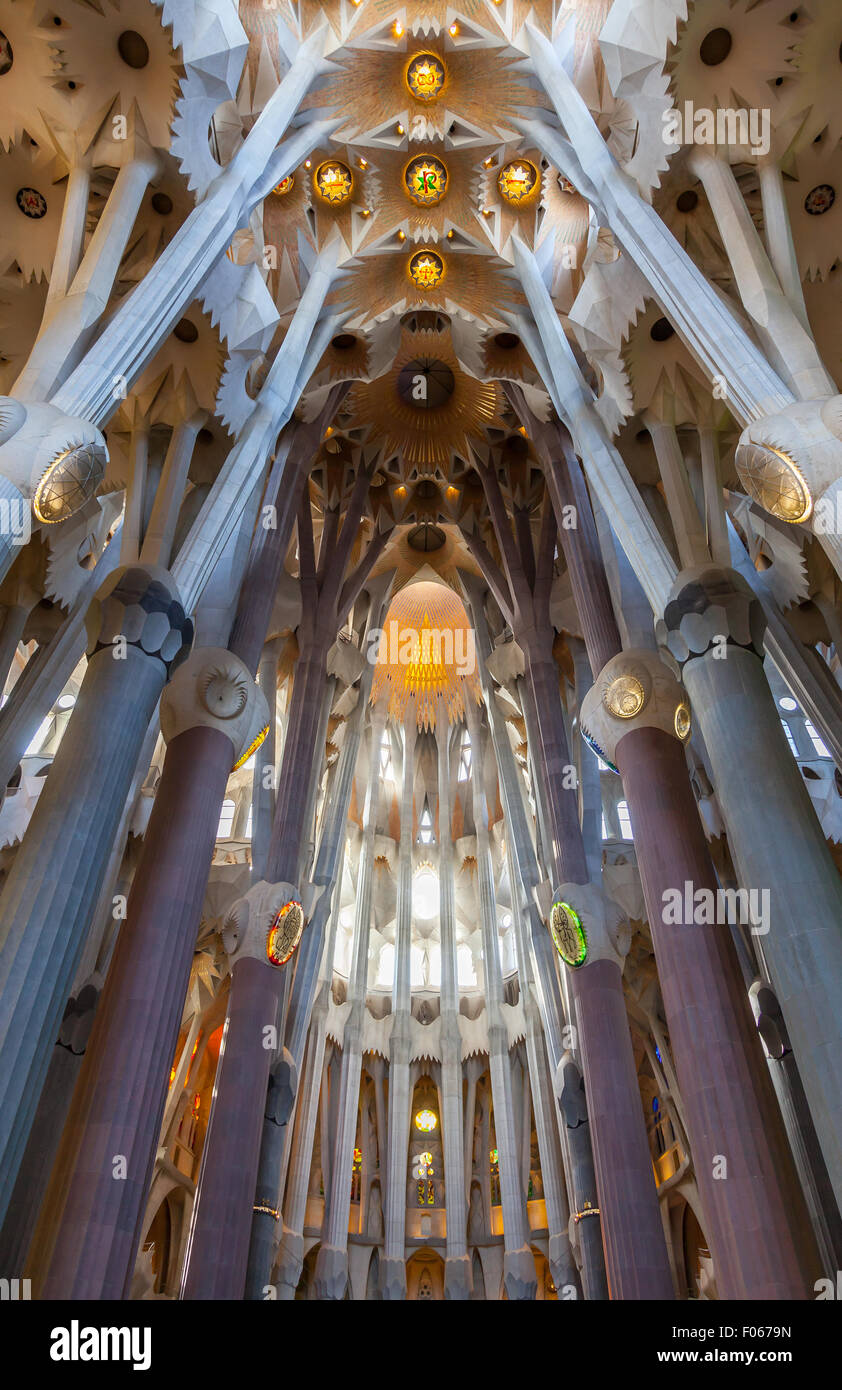 The sun shines through the stained glass windows of Gaudi's masterpiece ...