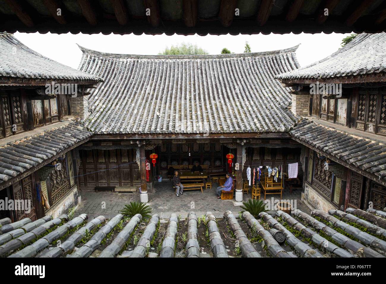 Honghe, China's Yunnan Province. 7th Aug, 2015. Villagers chat with ...