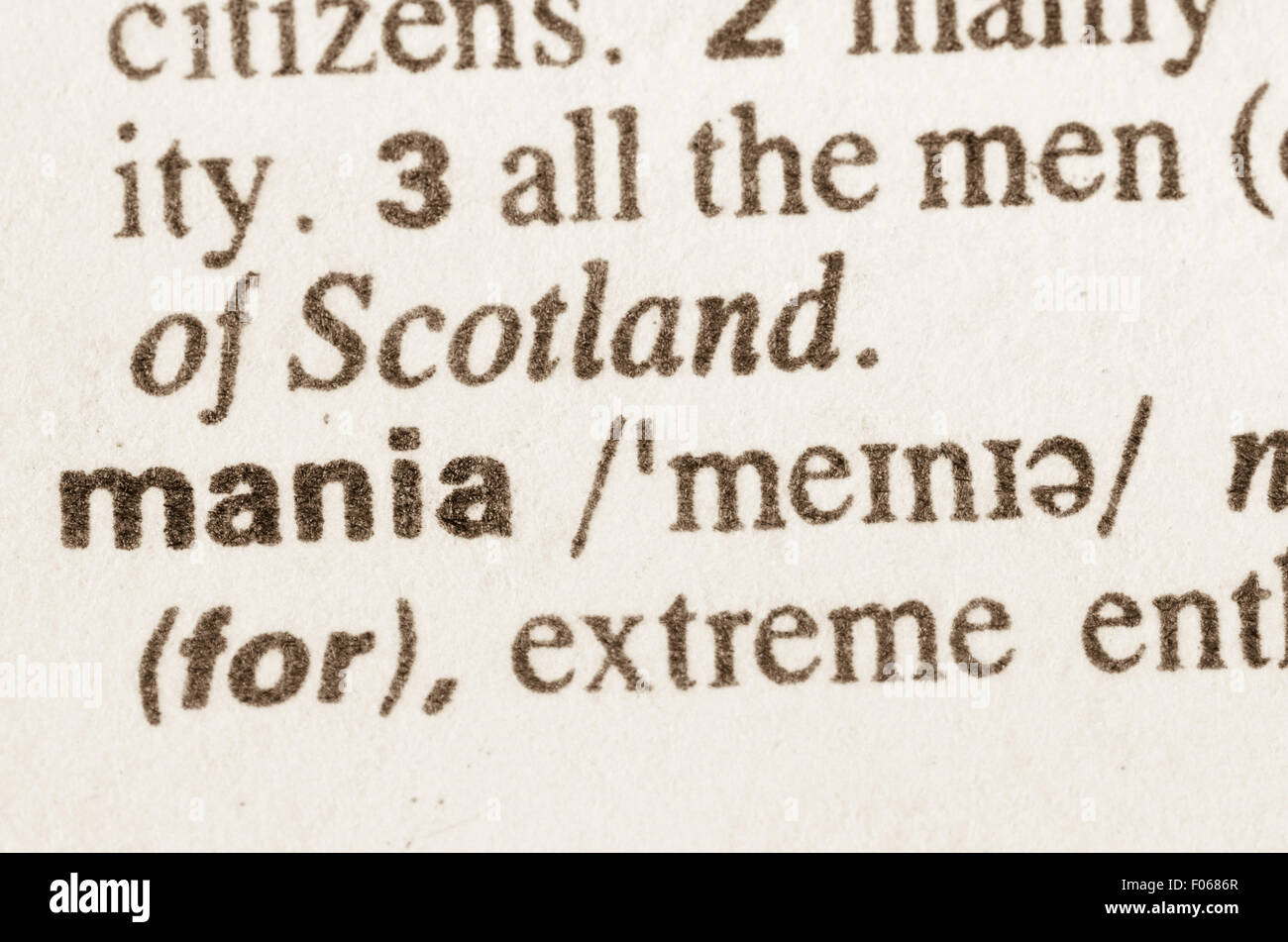 Definition of word mania in dictionary Stock Photo - Alamy