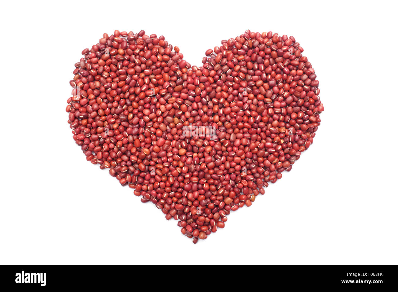 Red adzuki beans in a heart shape, isolated on a white background Stock ...