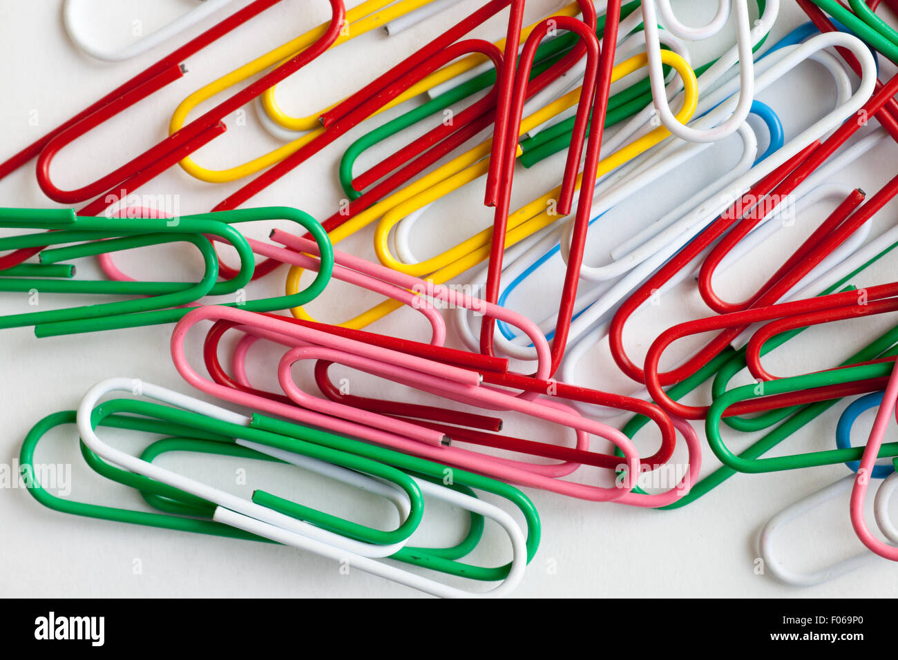 Paper clips on a white background Stock Photo - Alamy