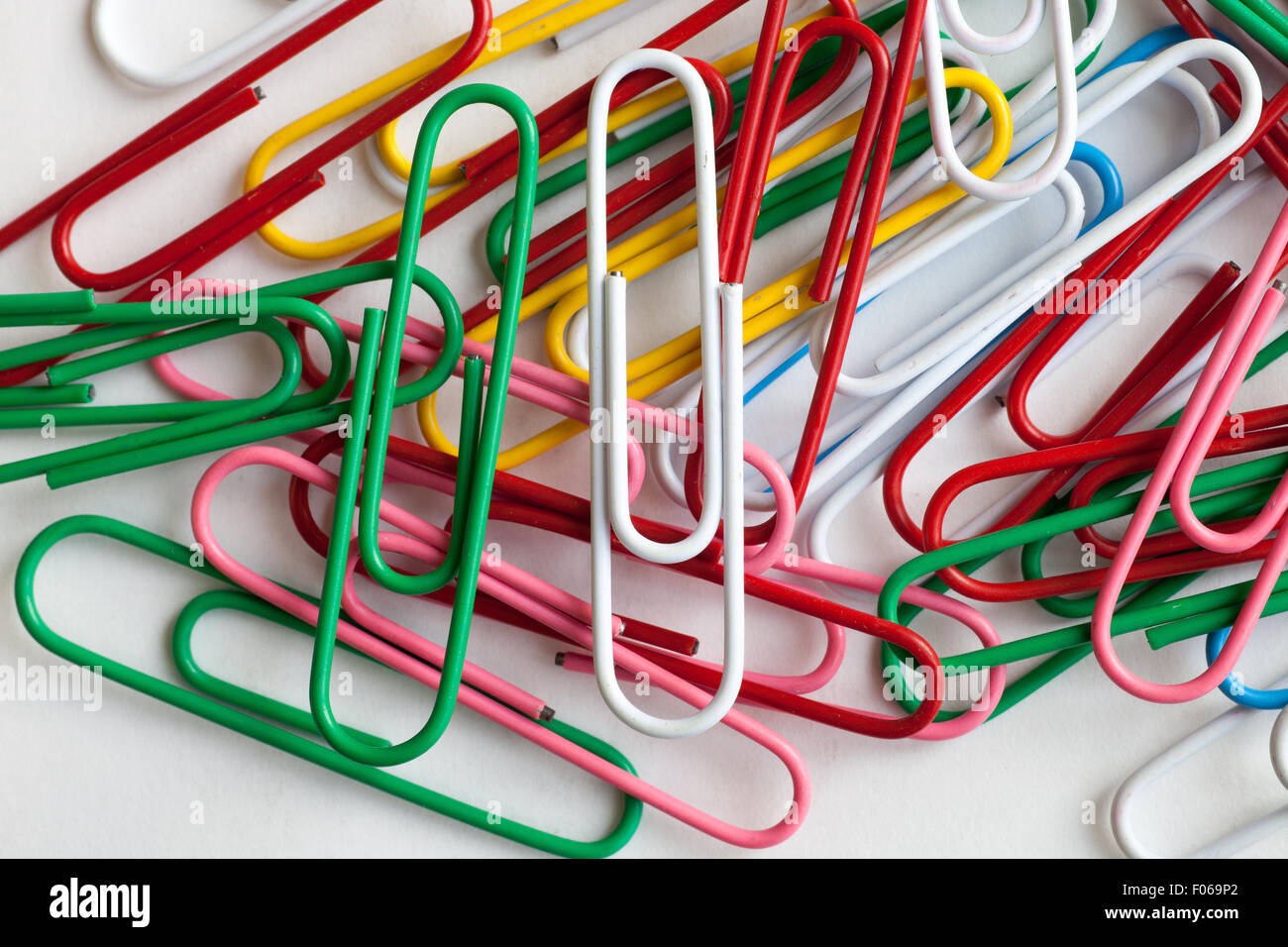 Paper clips on a white background Stock Photo - Alamy
