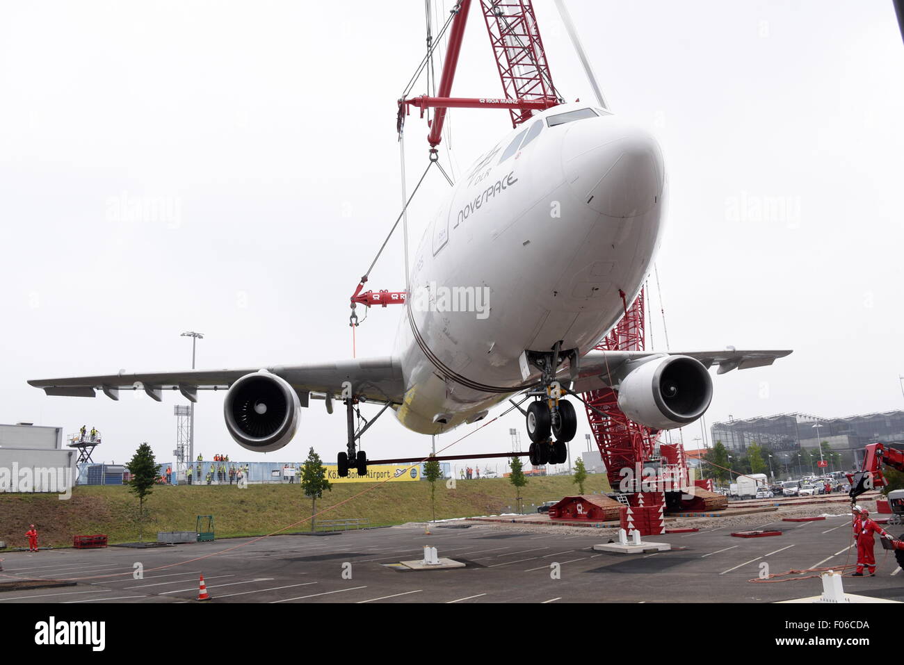 An Airbus plane type A 300 is lifted by a 60-metre-high crane onto a ...