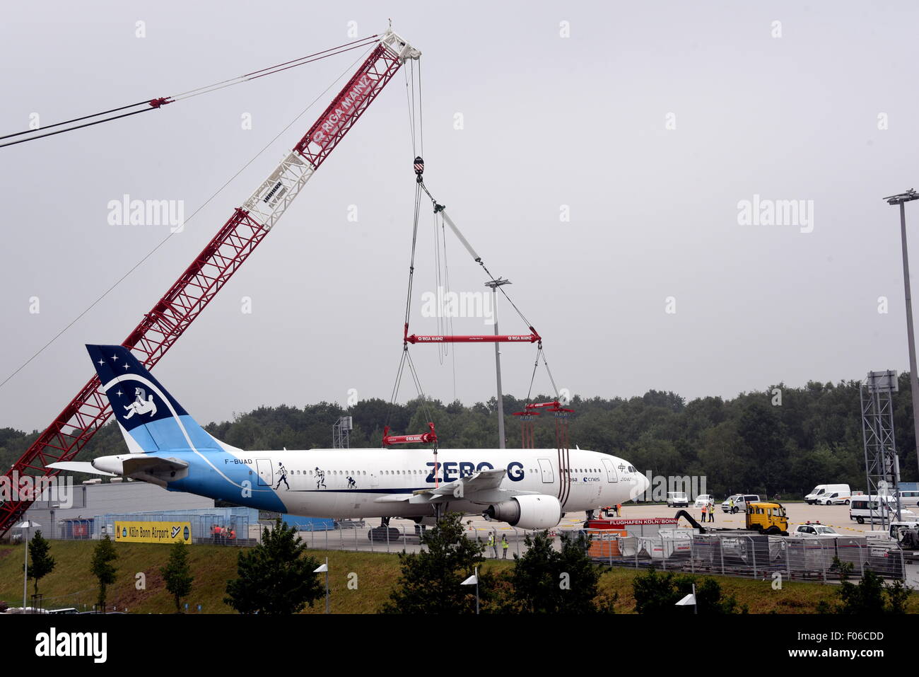 An Airbus A 300 is lifted onto a parking area using a 60-metre-high ...