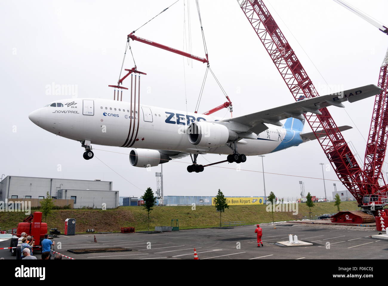 An Airbus A 300 is lifted onto a parking area using a 60-metre-high ...