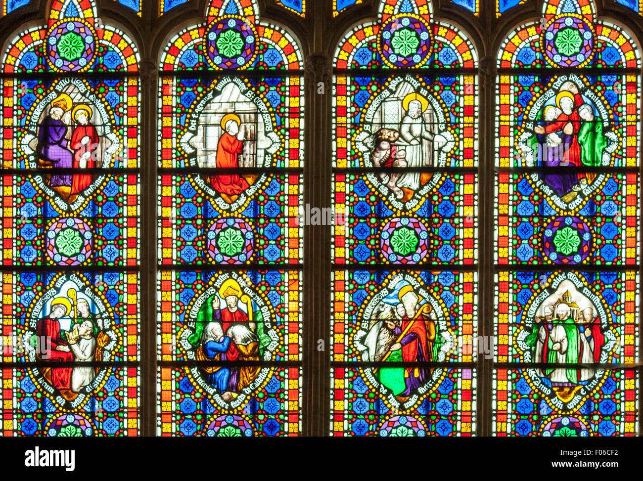 colorful stained glass window with saints Stock Photo - Alamy