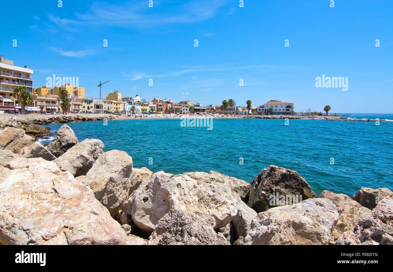 View towards the beach with rocks in foreground and Molinar Paseo ...
