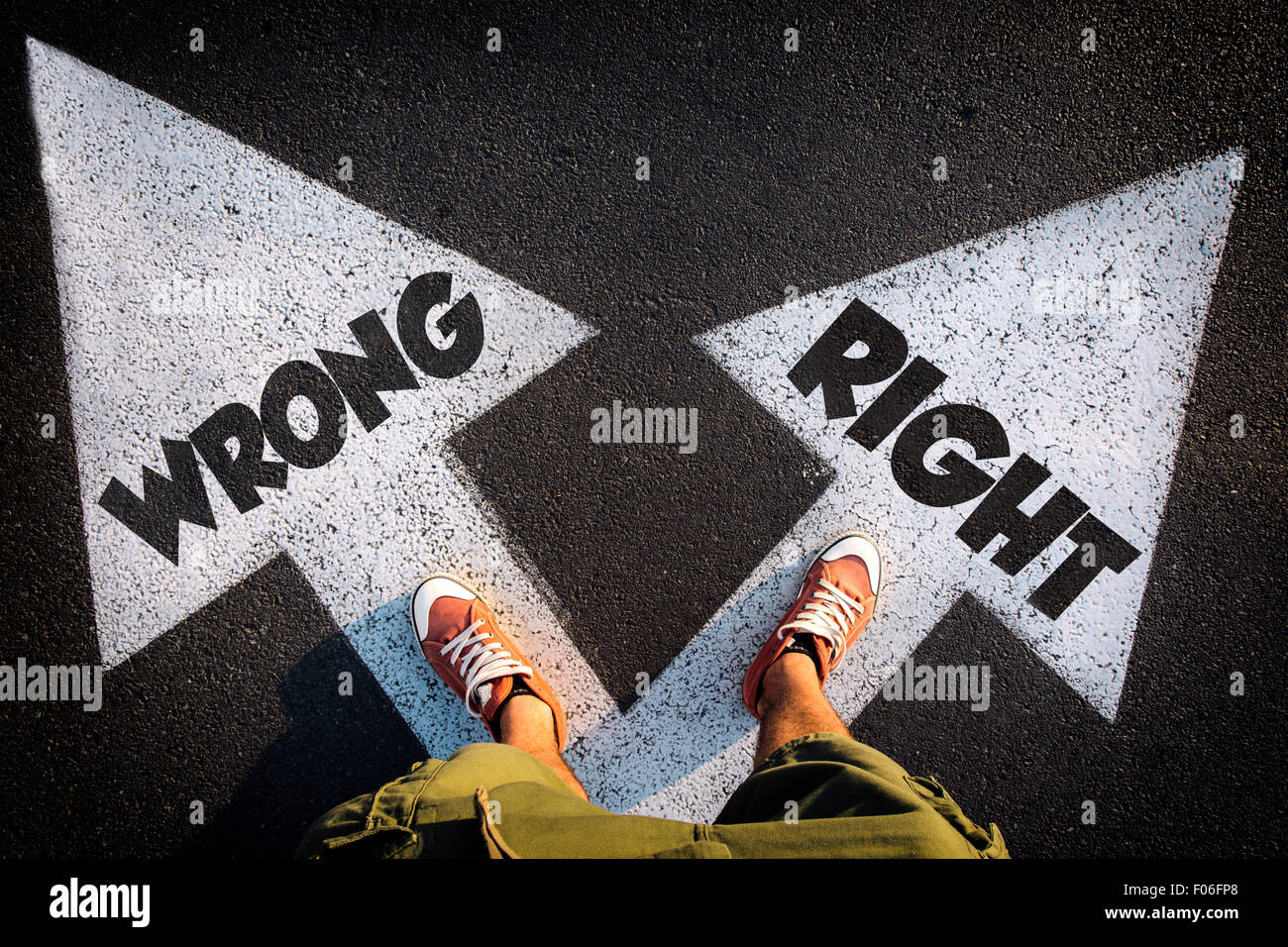 Wrong and right dilemma concept with man legs from above standing on ...