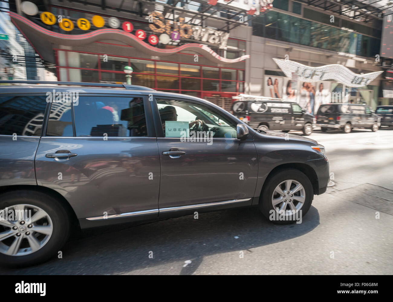 An Uber livery travels through Midtown Manhattan in New York on Friday ...