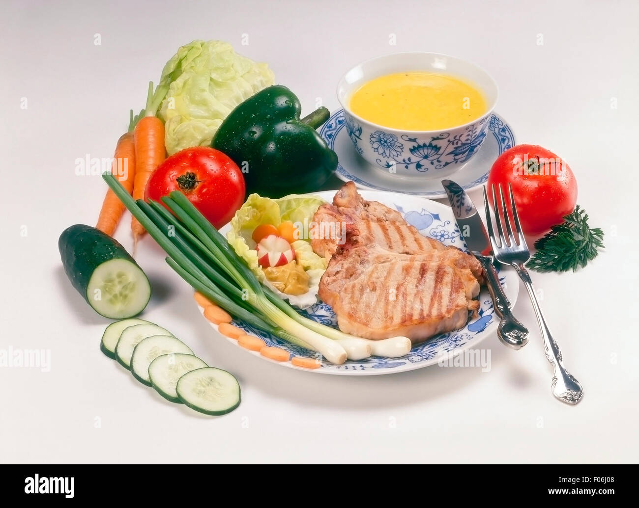 Rich beefsteak menu with miscellaneous vegetables Stock Photo - Alamy