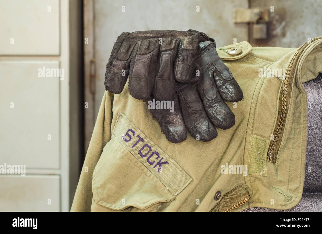 Leather glove and jacket for protection Stock Photo - Alamy