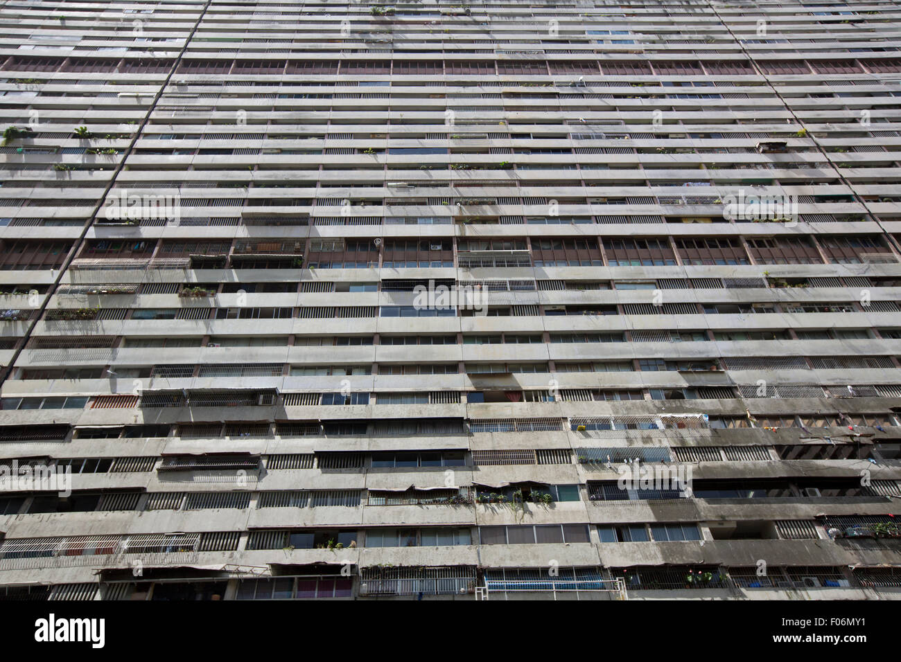 Old massive residential building in downtown with painters at work ...