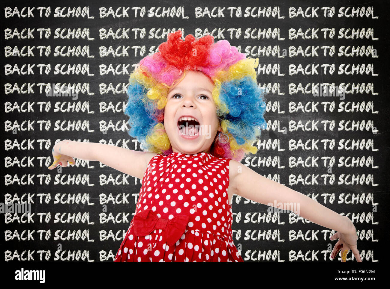 Happy child with back to school sign on chalkboard Stock Photo - Alamy