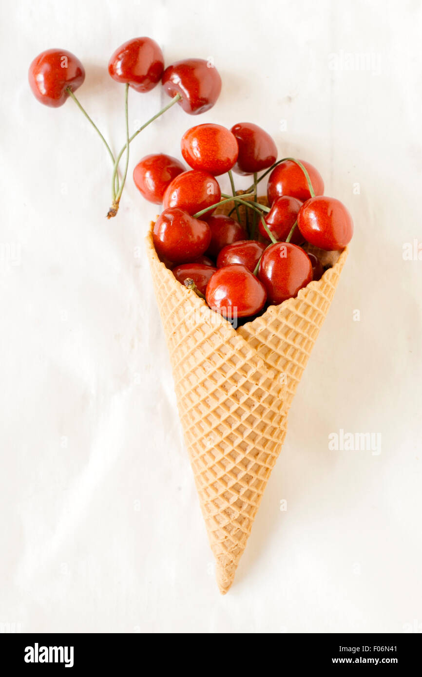 Cherries in the ice cream cone Stock Photo - Alamy