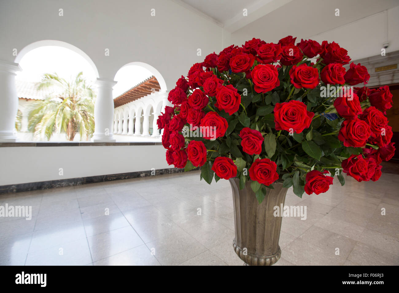 Huge bunch of red roses in stone vase located in Quito. Ecuador Stock ...